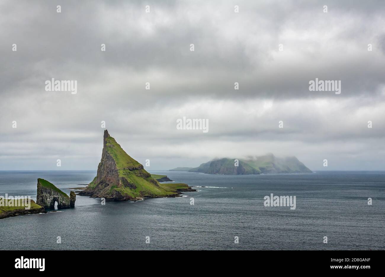Risin og Kellingin the giants of faroe islands with Mykines Stock Photo ...
