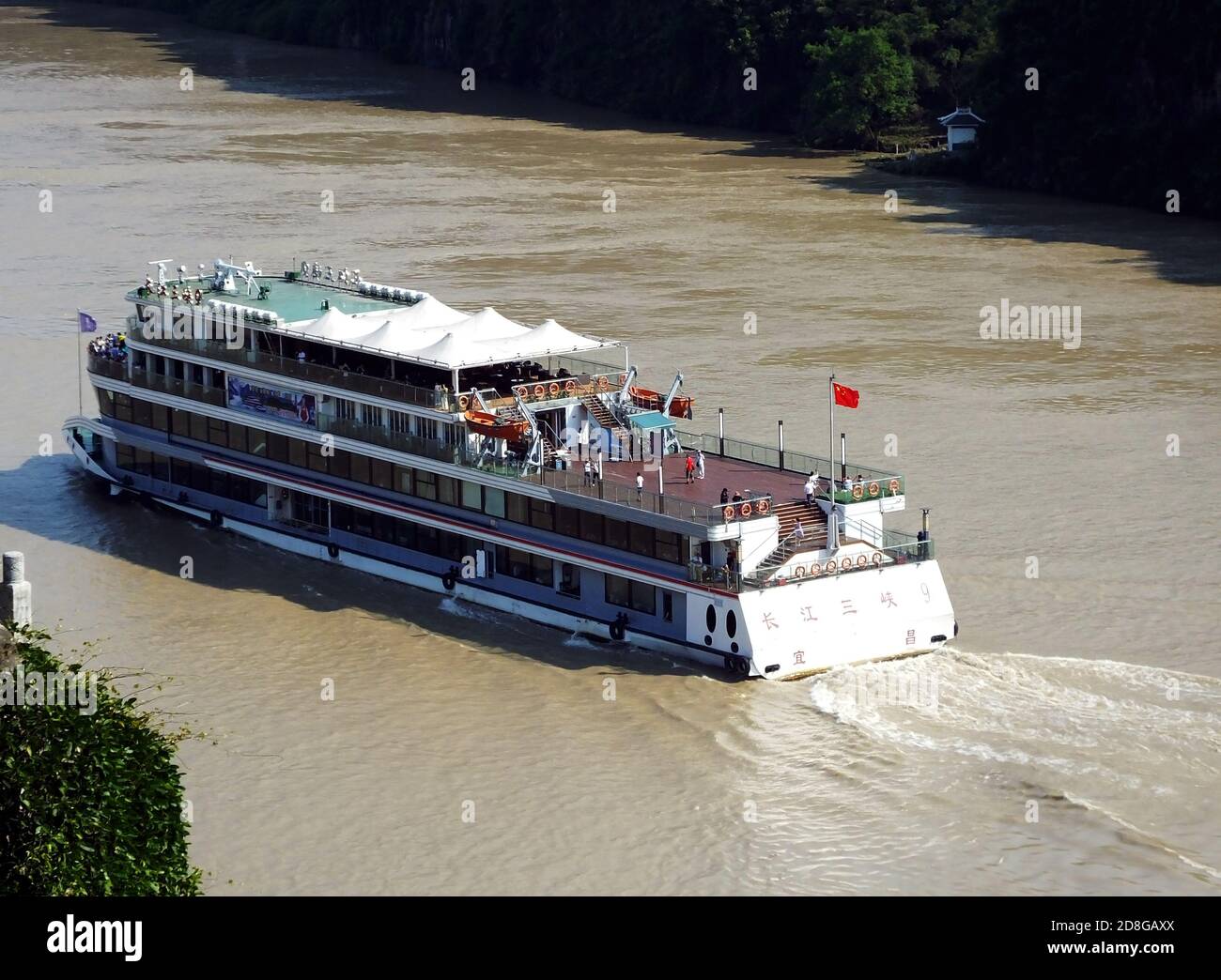 An aerial view of a ship cruising through Xiling Gorge, the largest and ...