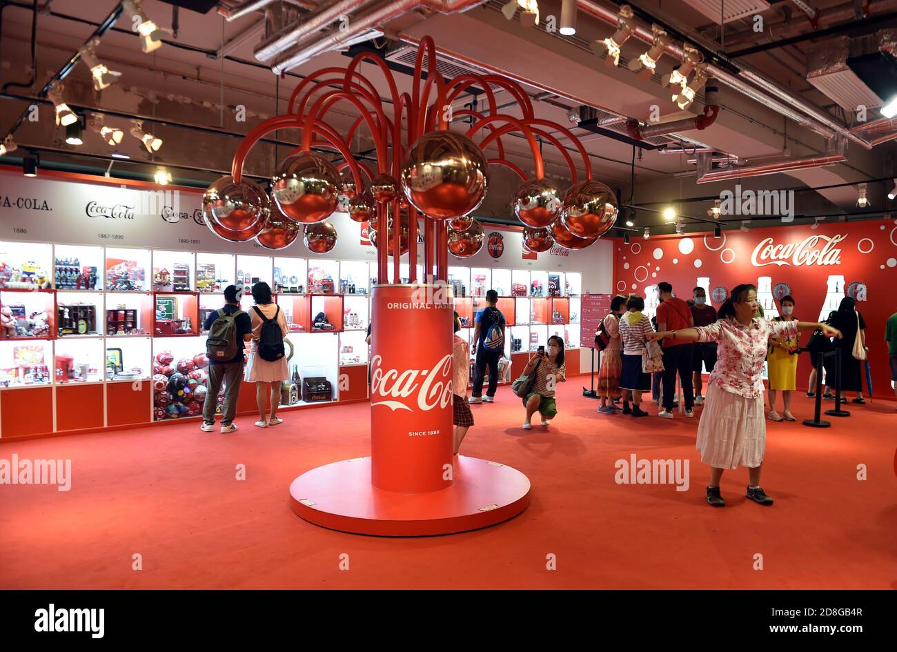 Bottles and toys of coca-cola are presented at the show in Hong Kong ...