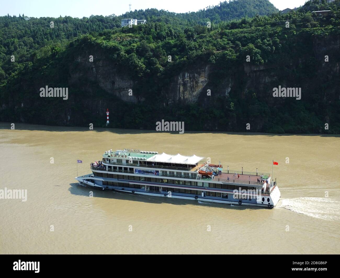 An aerial view of a ship cruising through Xiling Gorge, the largest and ...