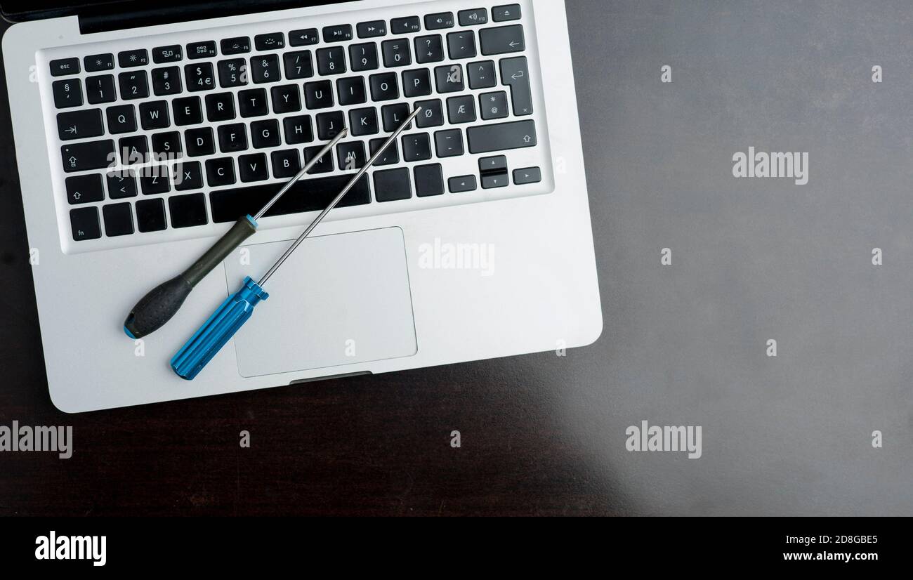 screwdriver and allen wrench, on wooden table. Technical support ...