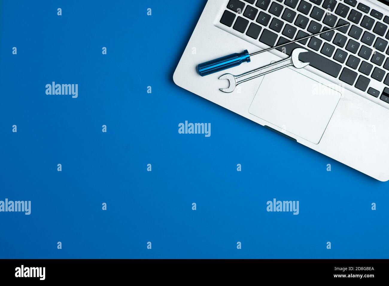 wrench and screwdriver, on blue background.Technical support concept ...