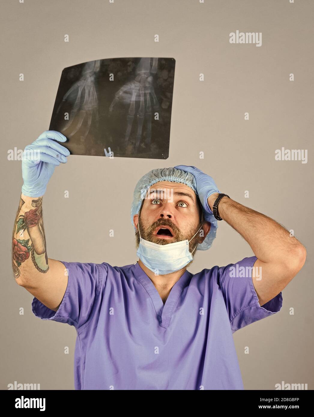 Doctor examines radiographic snapshot. Surgeon estimate damages ...