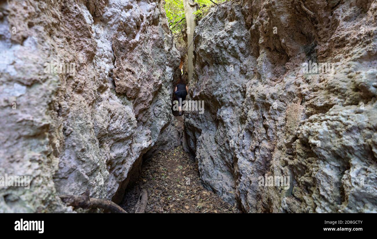 Hiking between narrow pass with huge walls Stock Photo - Alamy
