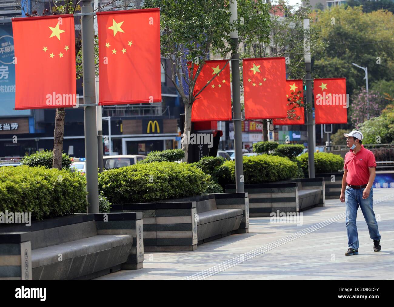 National flags of China are hung in the street light, welcoming the ...