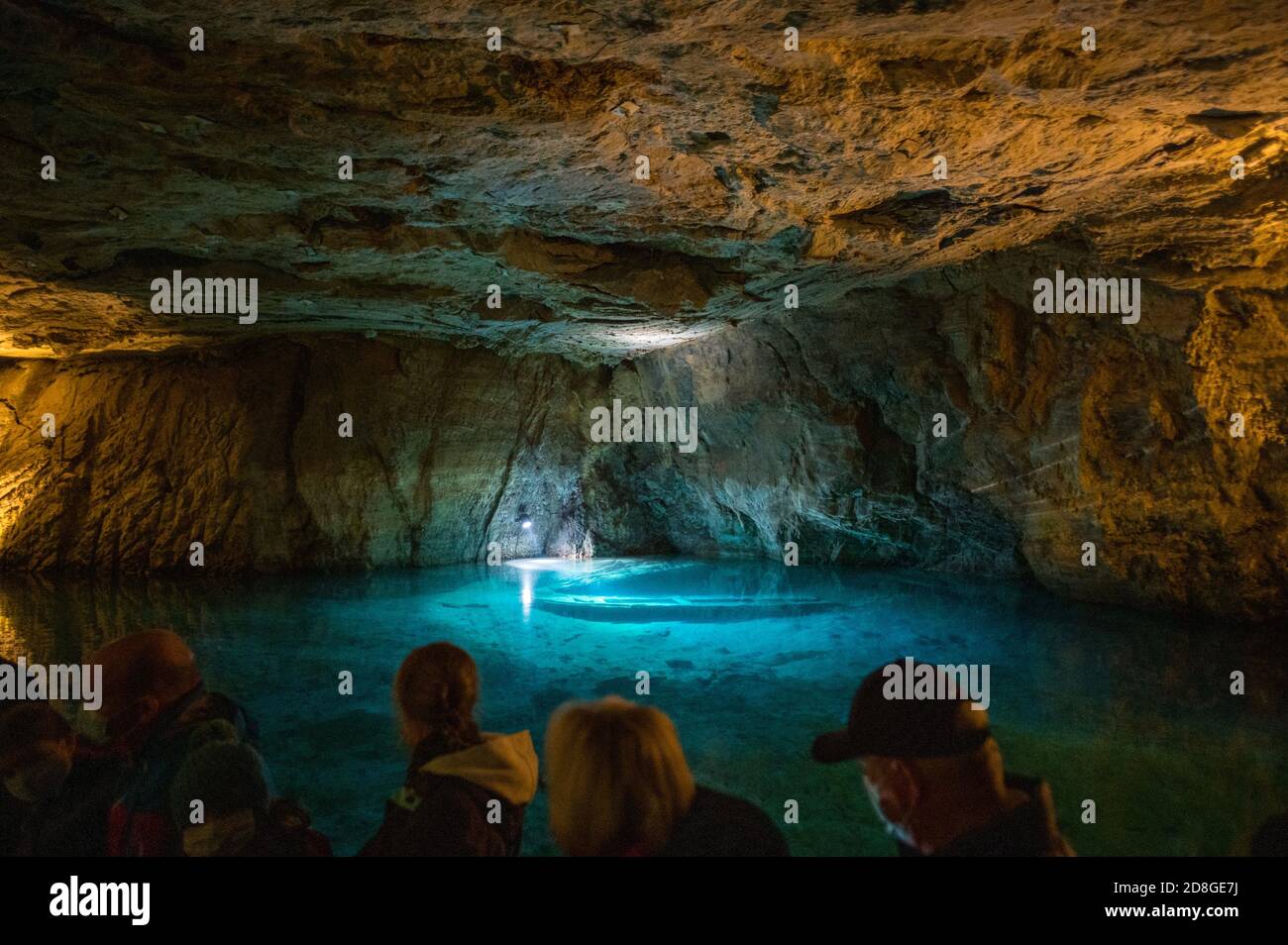 sunken boat in clear blue water of Lac Souterrain de Saint-Léonard ...
