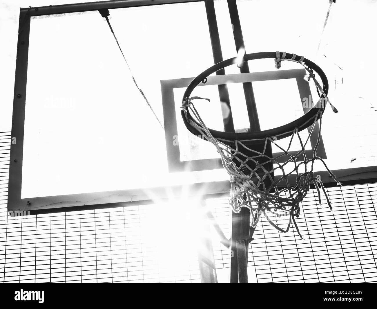 basketball ring with light from the rays of the sun Stock Photo - Alamy