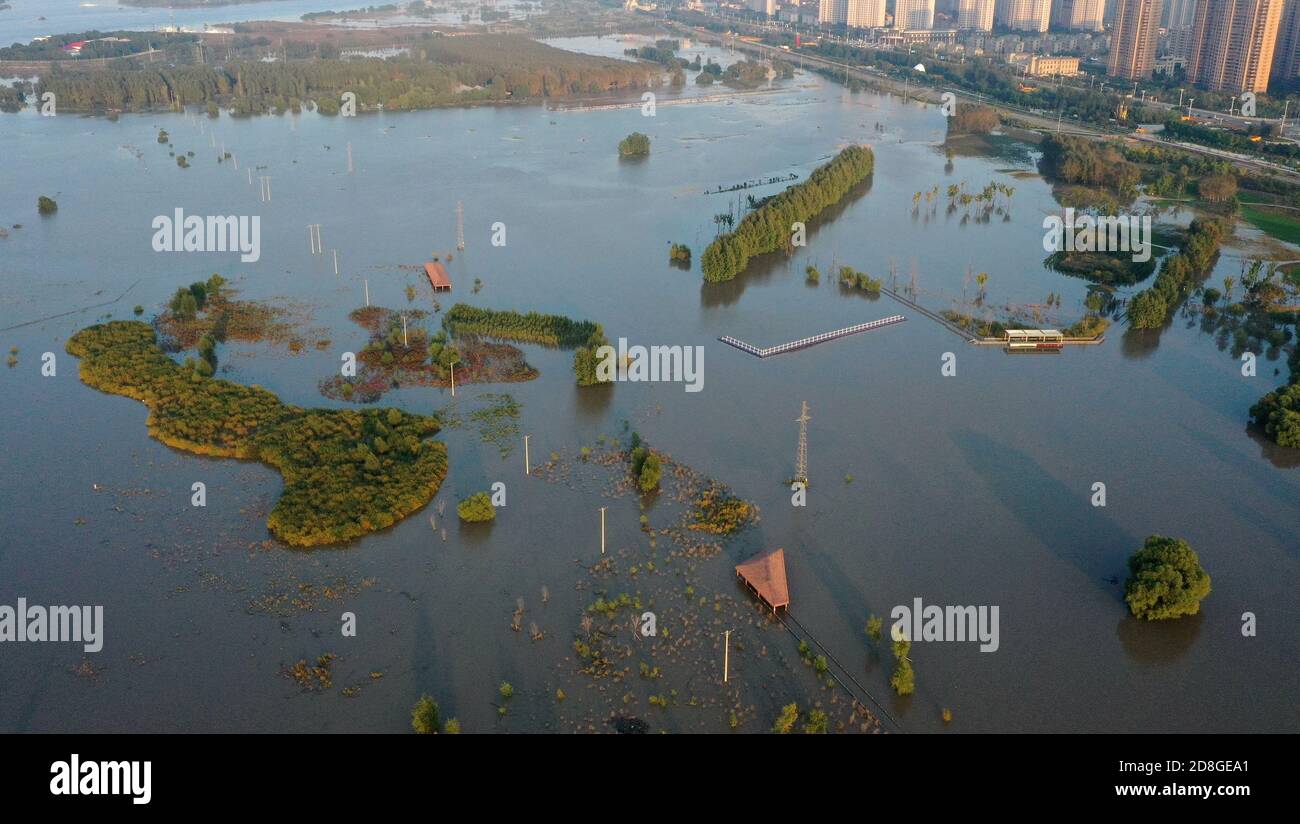 Aerial view of the river banks submerged by rising water of Songhua ...