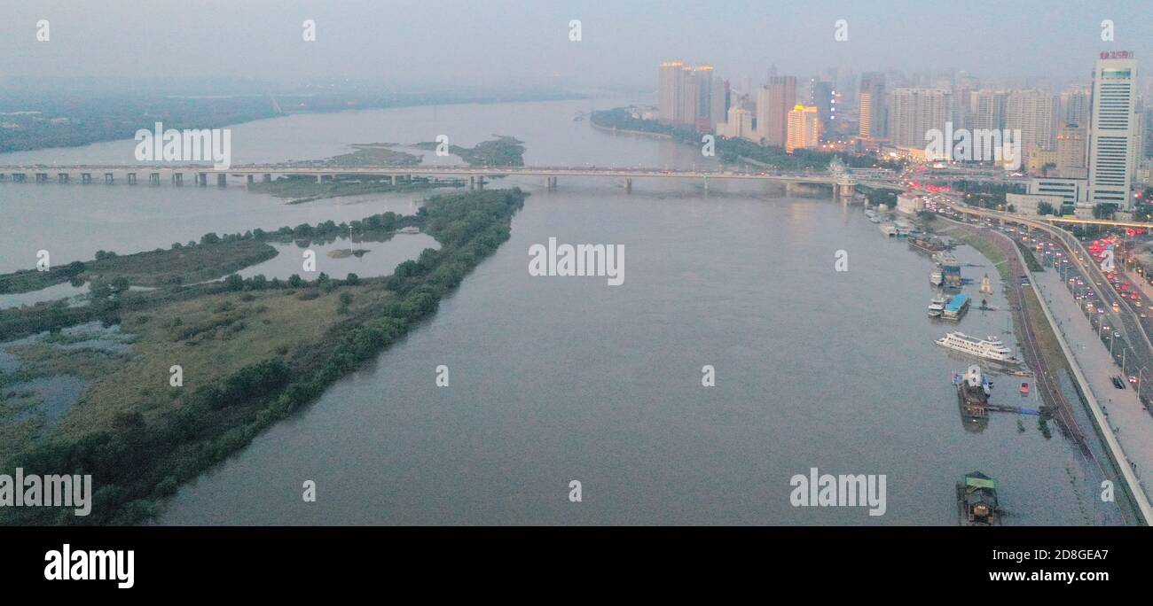 Aerial view of the river banks submerged by rising water of Songhua ...