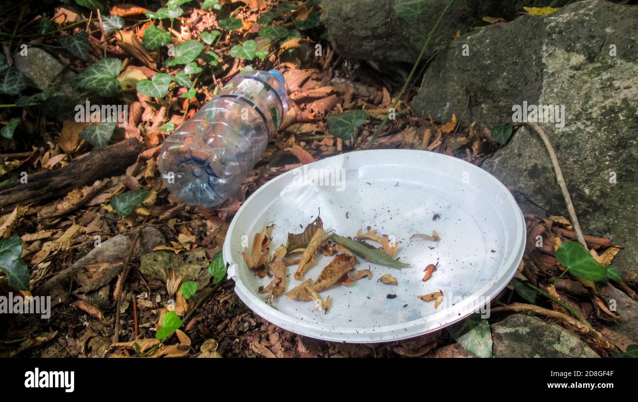Plastic waste. Ecological dirt spilled garbage on the ground of the big ...