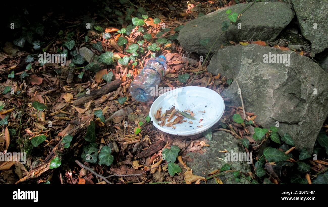Plastic waste. Ecological dirt spilled garbage on the ground of the big ...