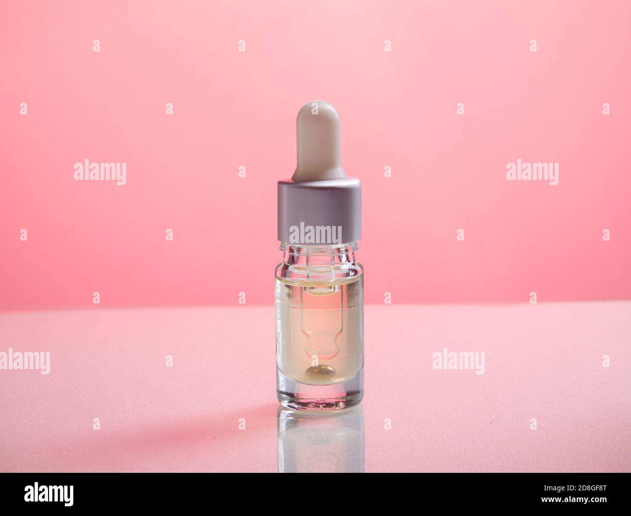 Amber glass bottles on pink background. Natural organic cosmetic ...