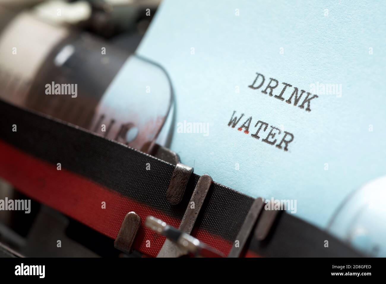 Drink water phrase written with a typewriter Stock Photo - Alamy