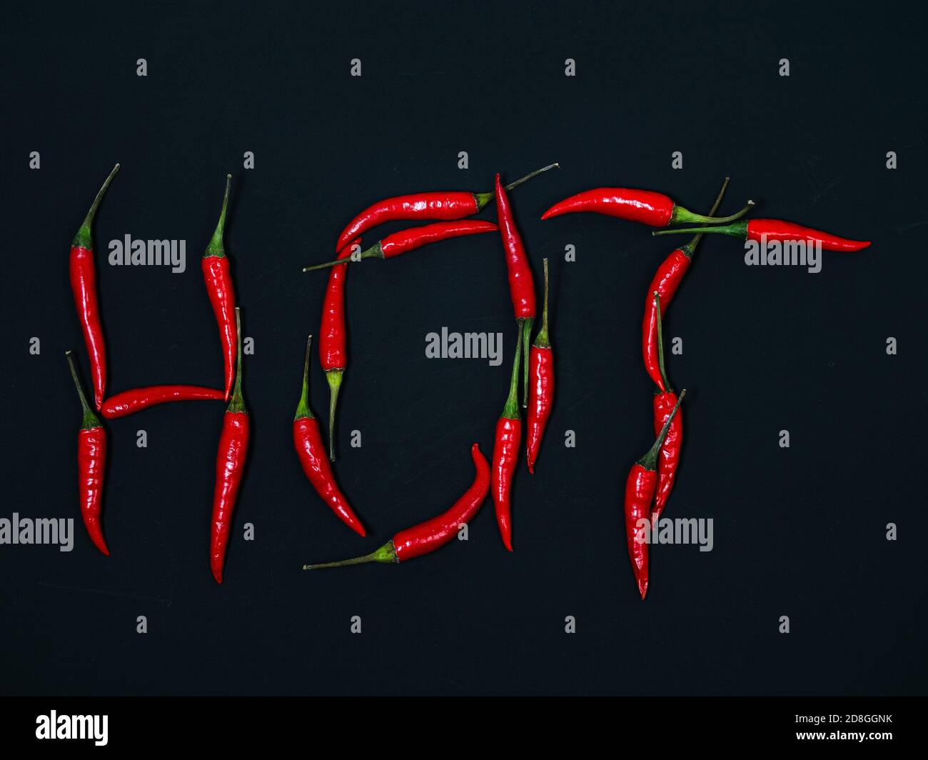Word Hot Red Hot Chili Peppers On Black Dark Background on Black Table ...