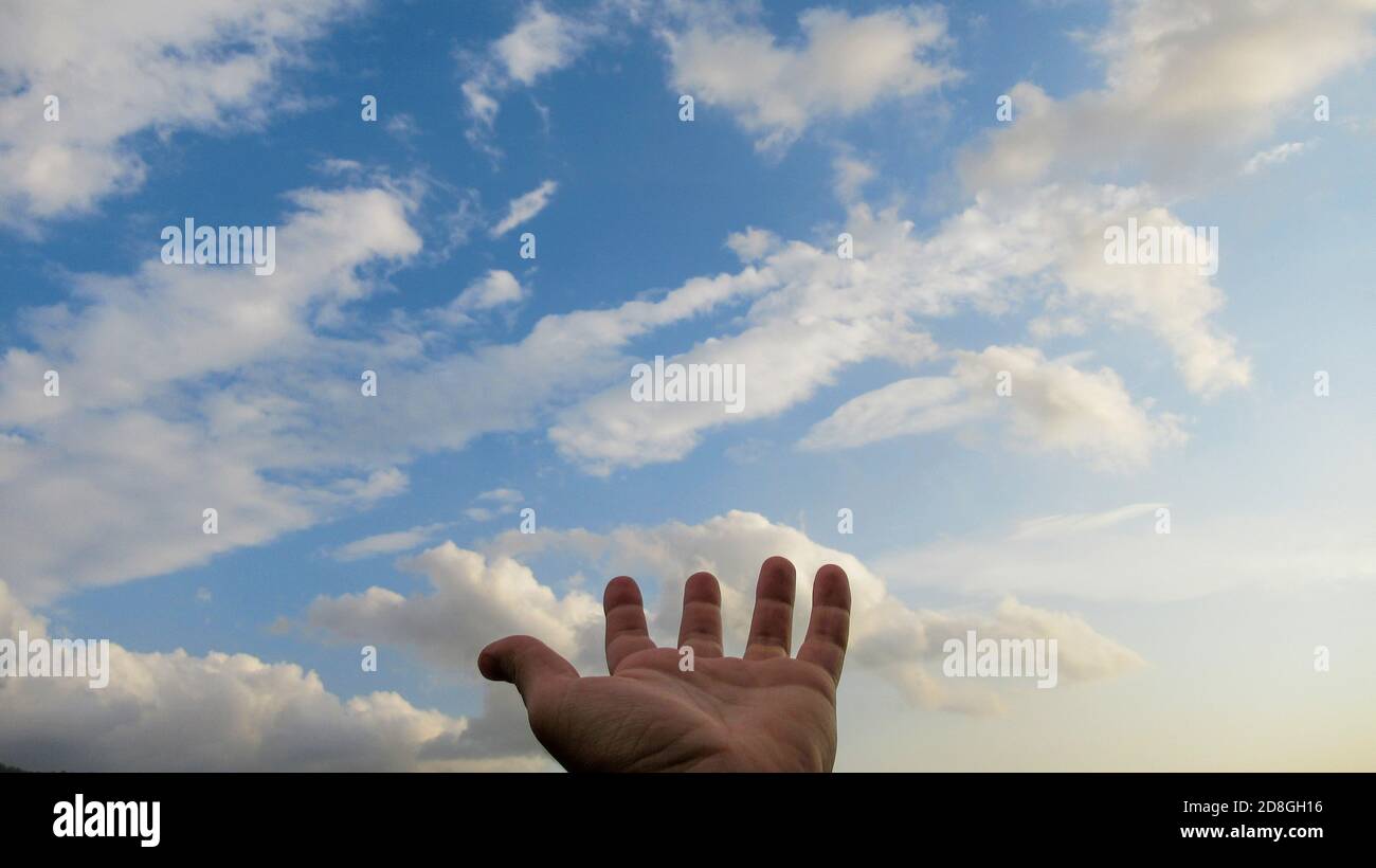 Man reaching towards sky hi-res stock photography and images - Alamy