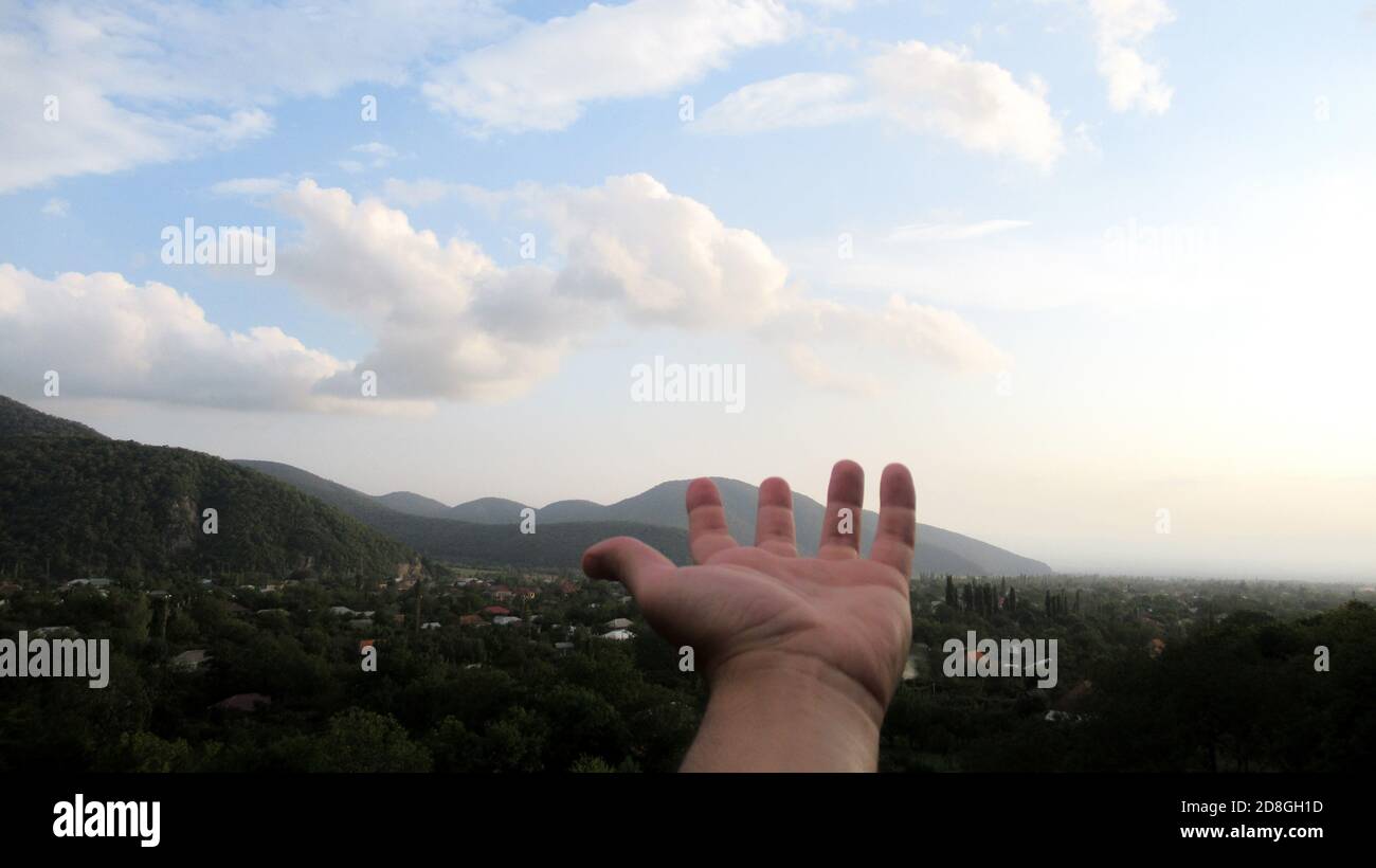 Hand of a man reaching to towards sky Stock Photo - Alamy