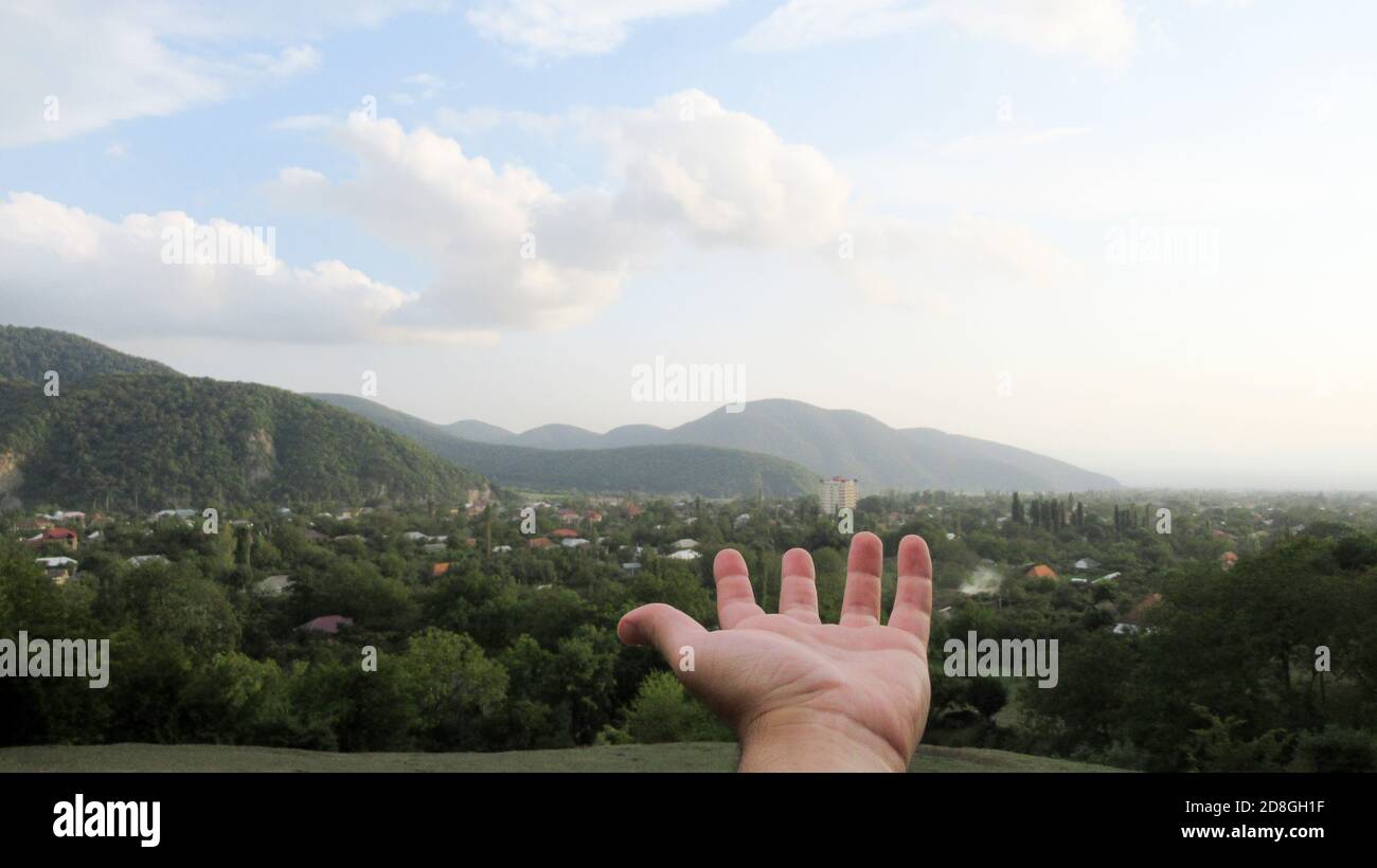 Hand of a man reaching to towards sky Stock Photo - Alamy