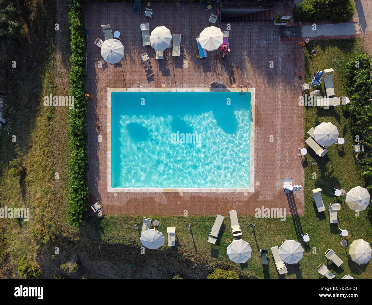 Aerial view of swimming pool with shower outdoors. Beautiful pool with ...