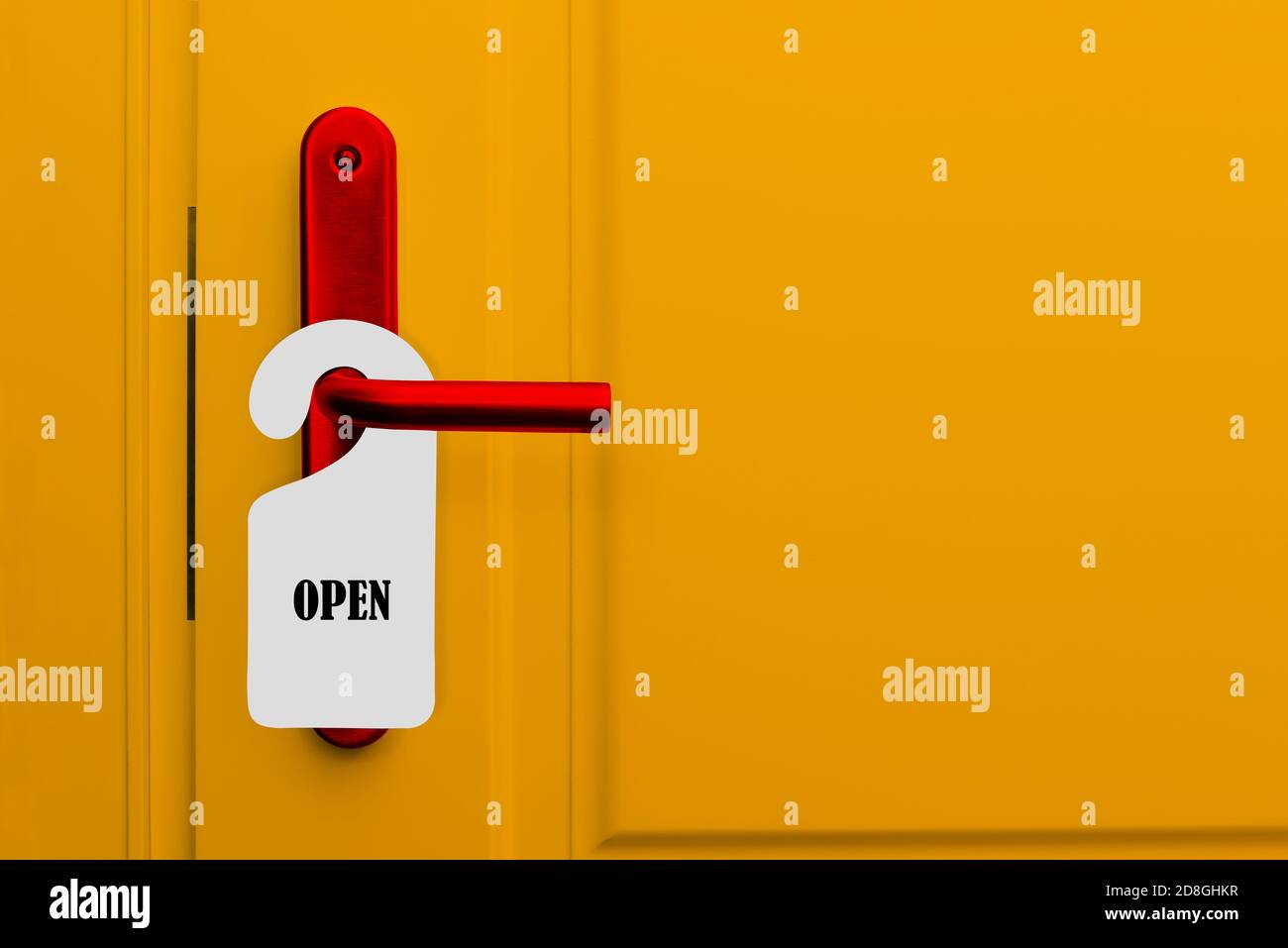 The door with the sign is open. Yellow door of hotel, restaurant or bar ...
