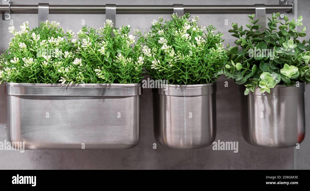 Metal cachepot with artificial flowers for kitchen design Stock Photo ...