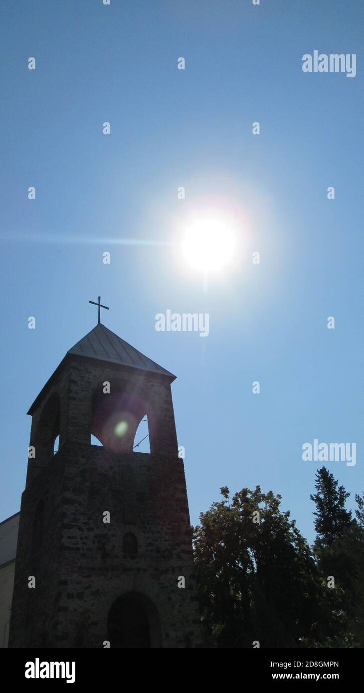 A sun light comes behind of a orthodox church building with a christian ...