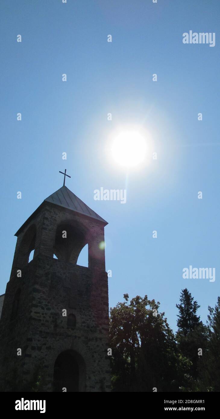 A sun light comes behind of a orthodox church building with a christian ...