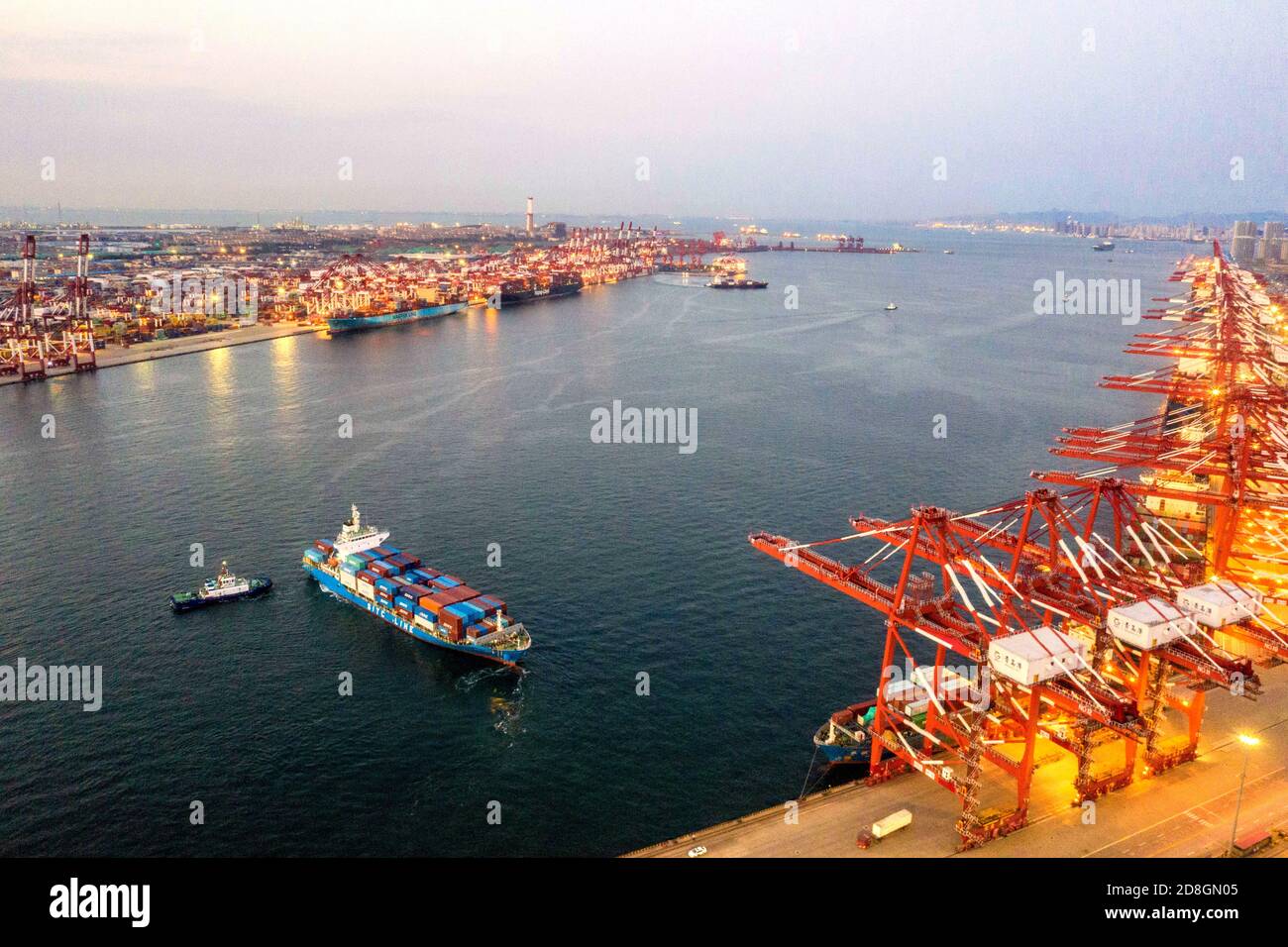 Aerial view of the hustle and bustle at night at Qingdao Port in ...