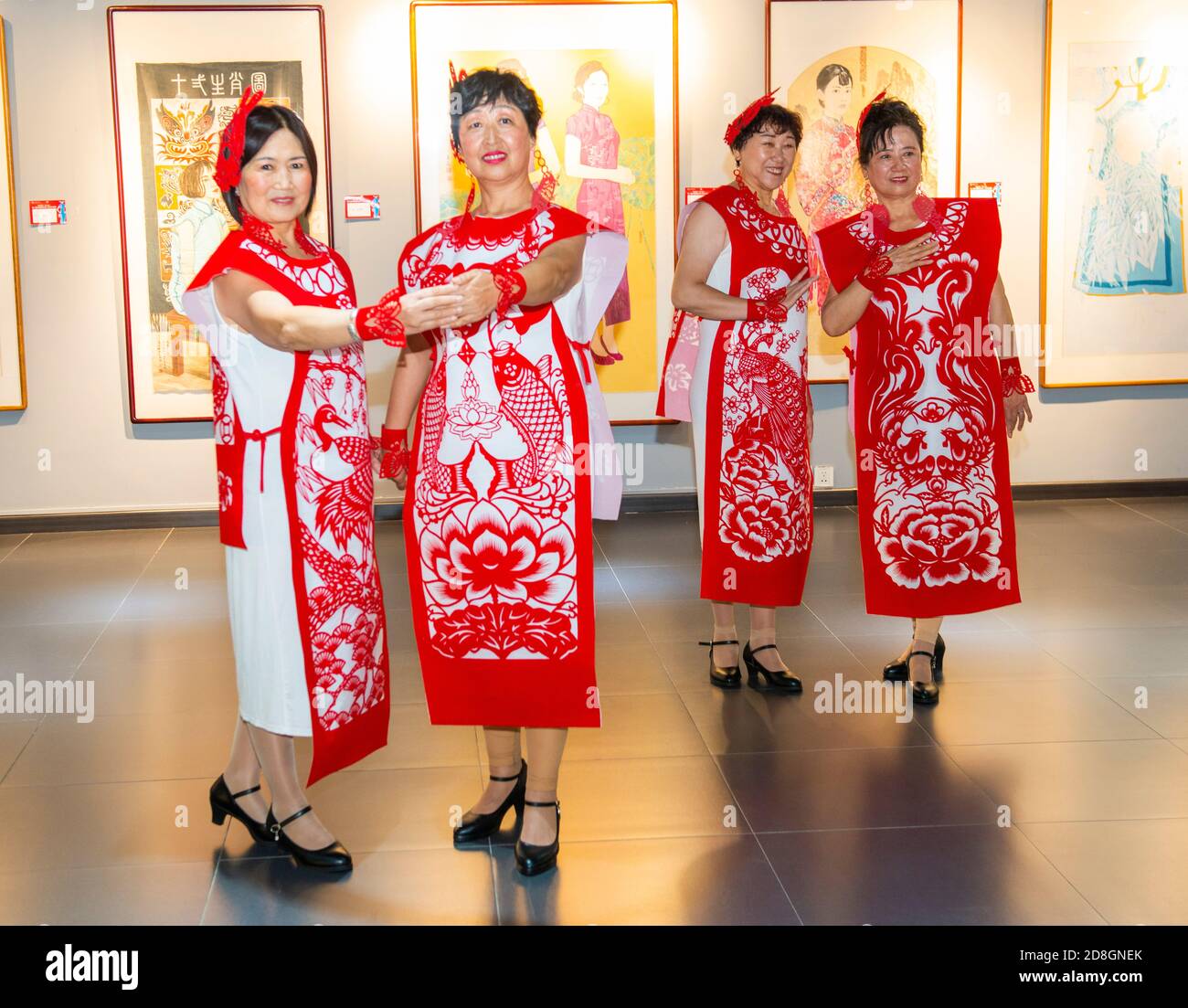 Elder models present papercut qipao or Chinese long gown at Shenyang ...