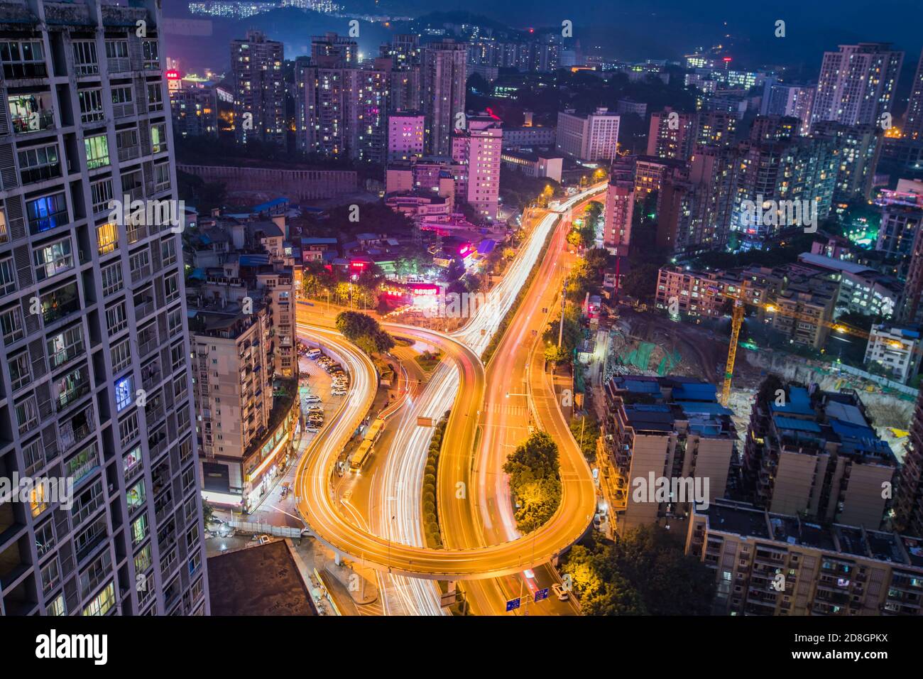 An aerial view of vehicles moving on a flyover which looks like an ...