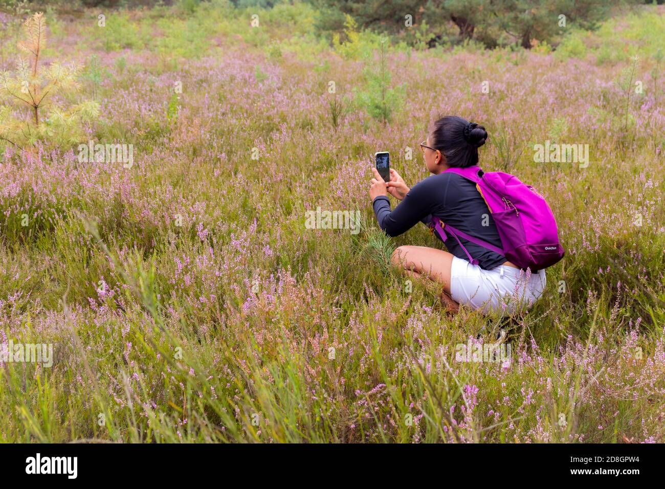Woman squatting down hi-res stock photography and images - Alamy