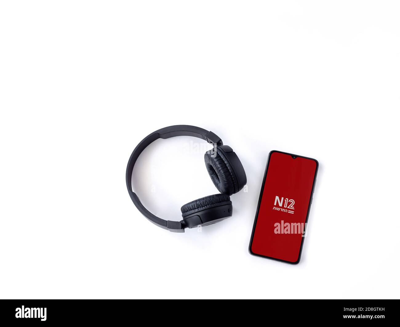 Lod, Israel - July 8, 2020: Black mobile smartphone with N12 app launch ...