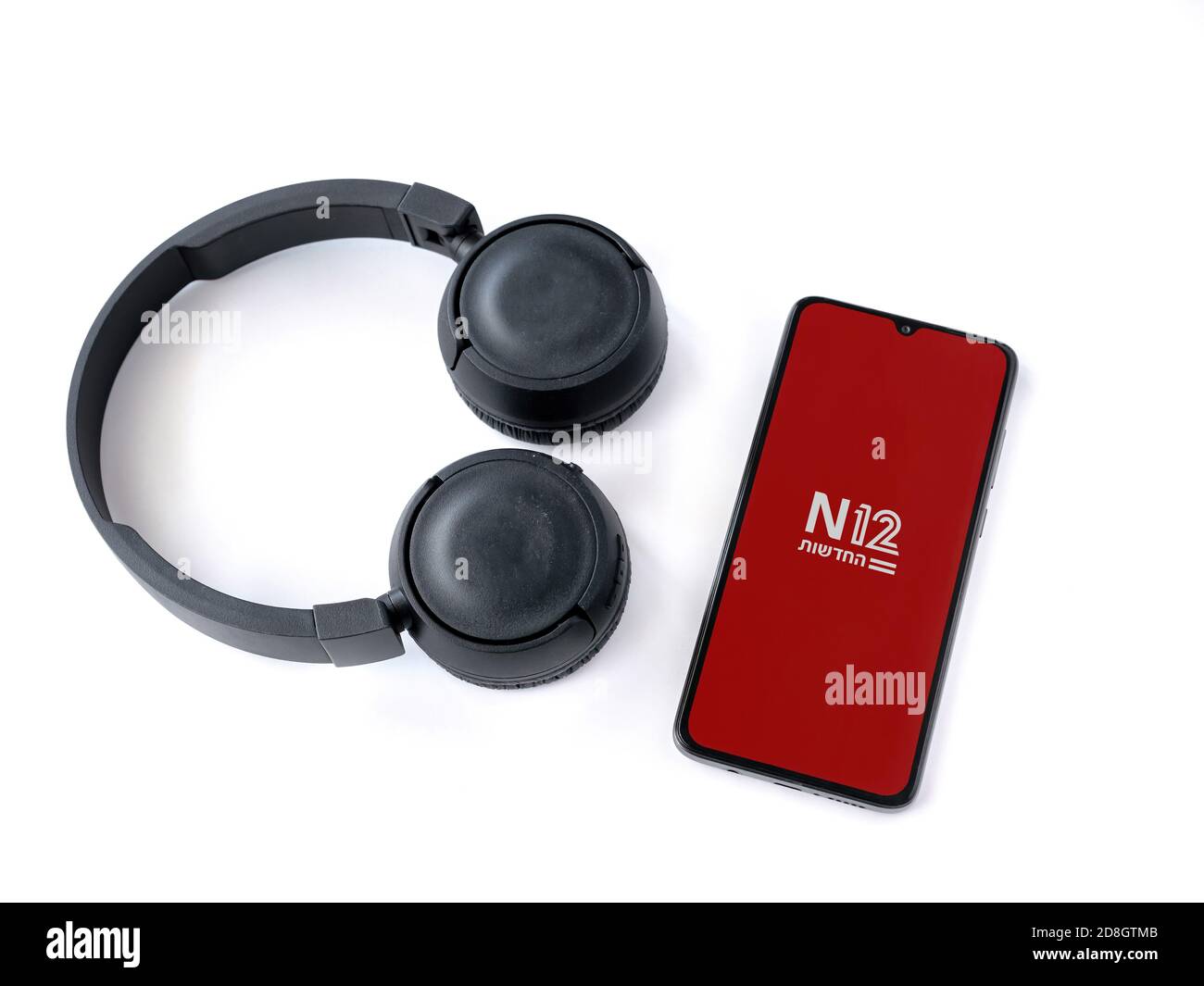 Lod, Israel - July 8, 2020: Black mobile smartphone with N12 app launch ...