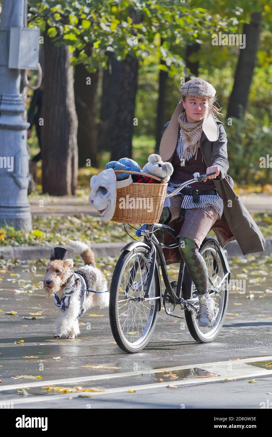 Russia. Moscow. City life. Young woman during a cosplay bike ride in ...