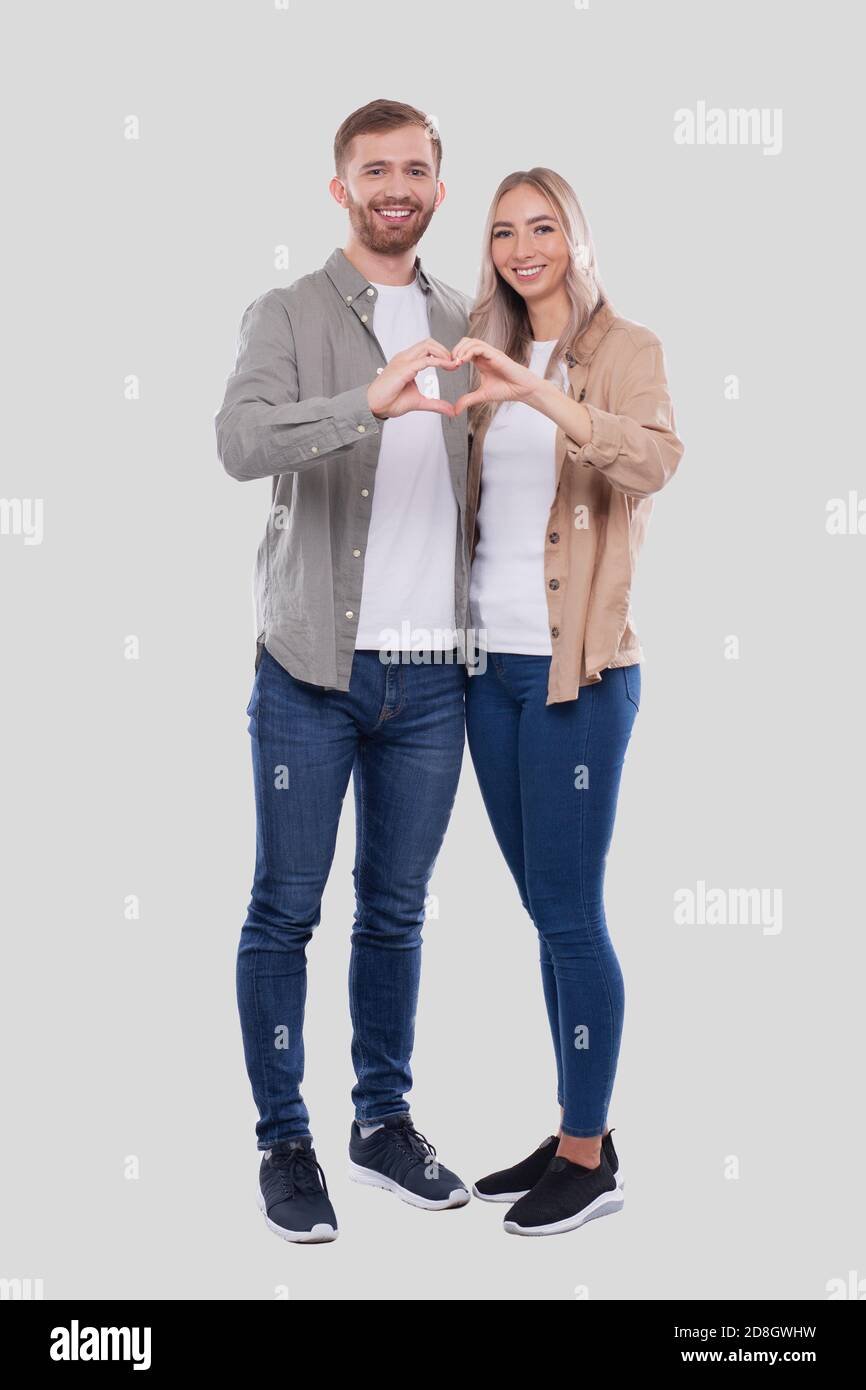 Couple Showing Heart Sign. Couple Standing Showing Love Sign ...