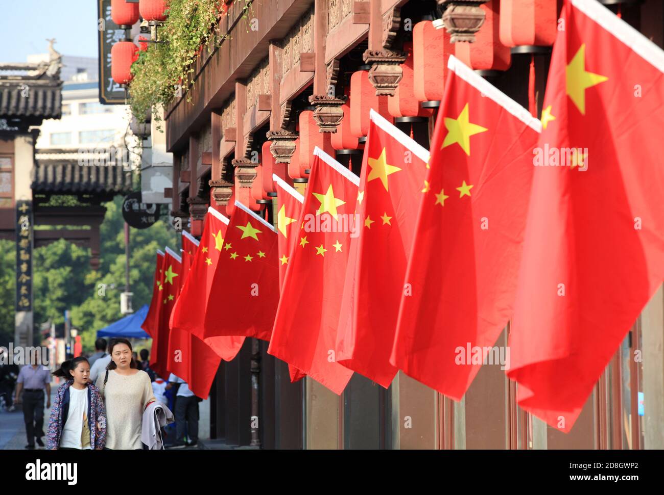 A line of Chinese national flags fly on the street prior to the ...