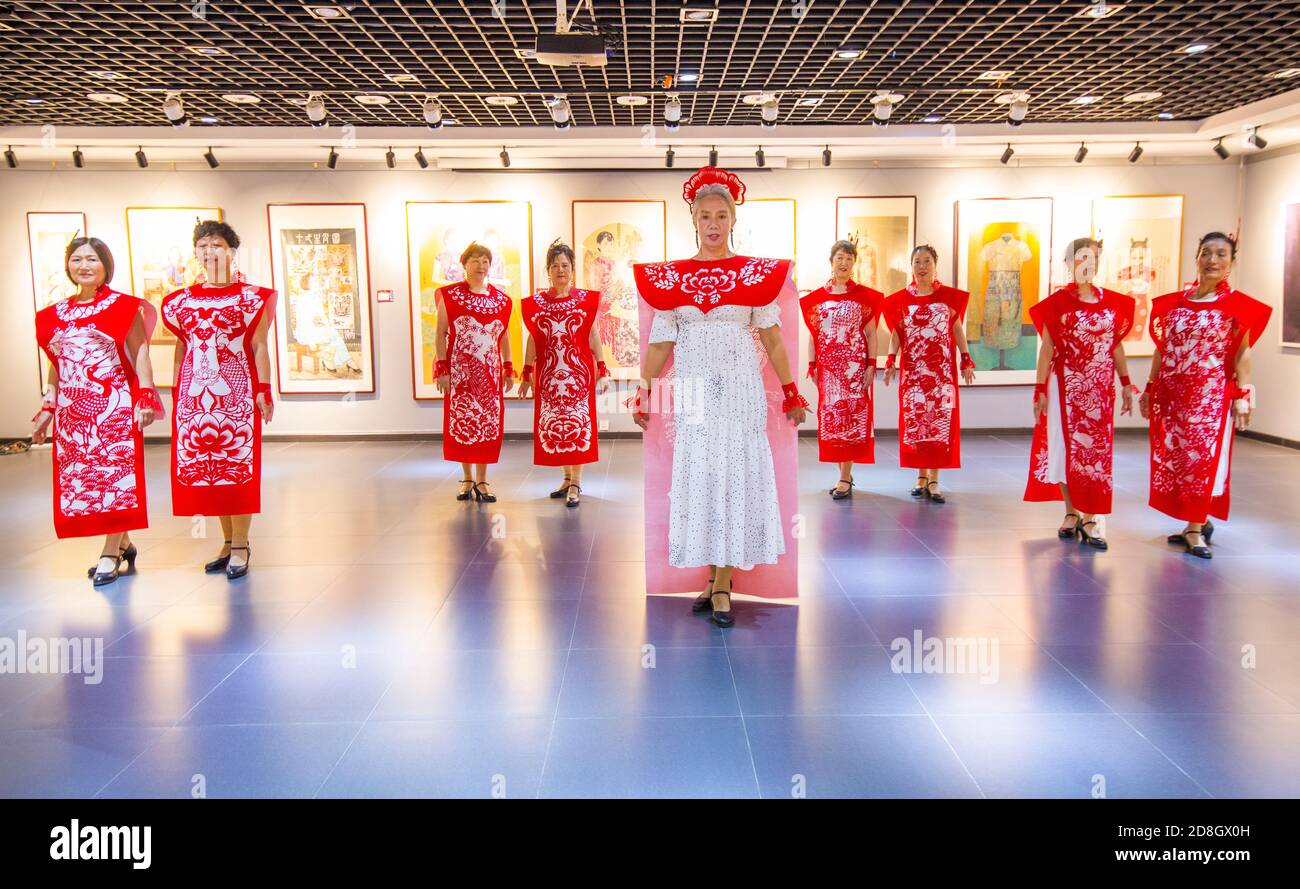 Elder models present papercut qipao or Chinese long gown at Shenyang ...