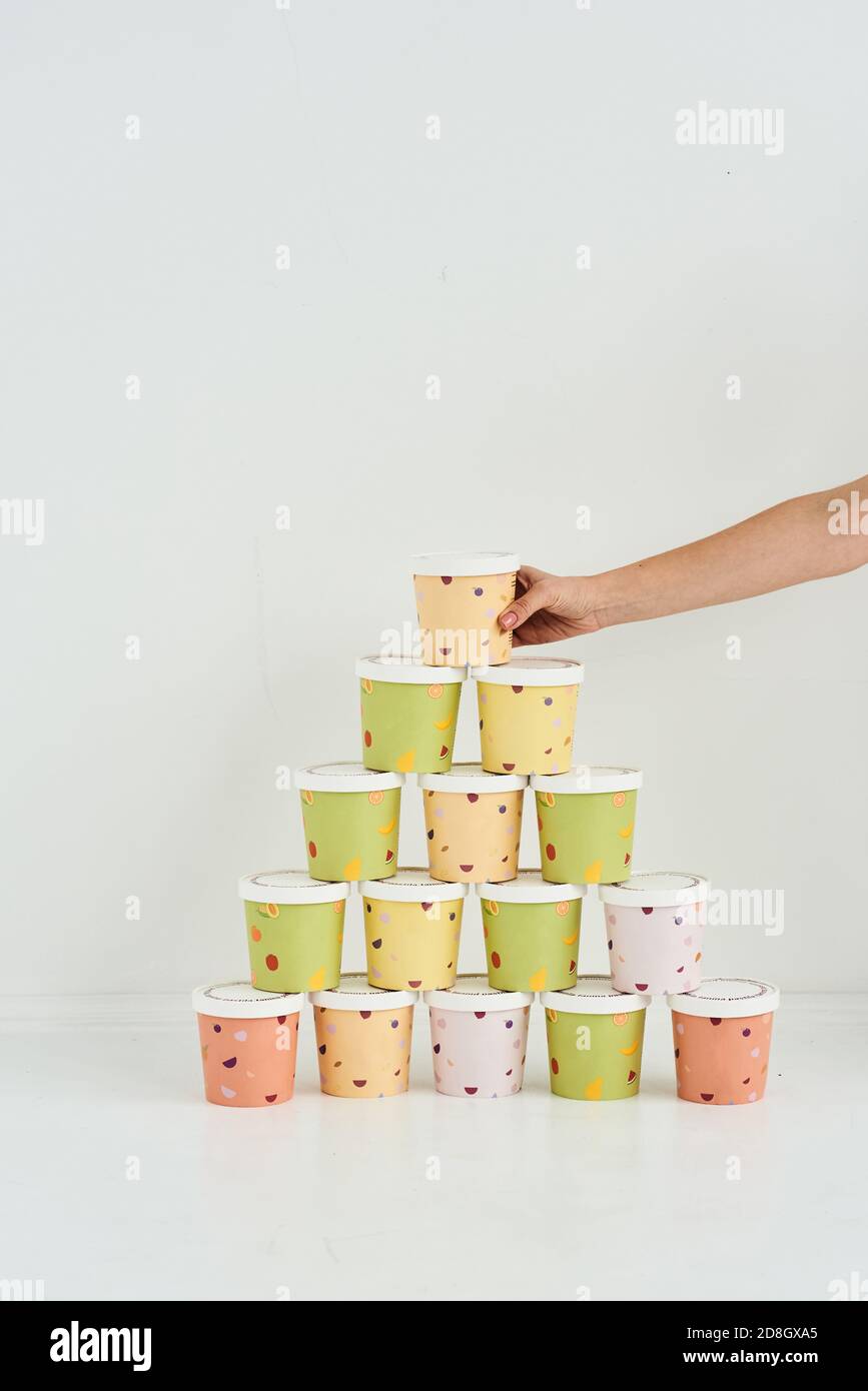 Colorful paper cups on white background Stock Photo - Alamy
