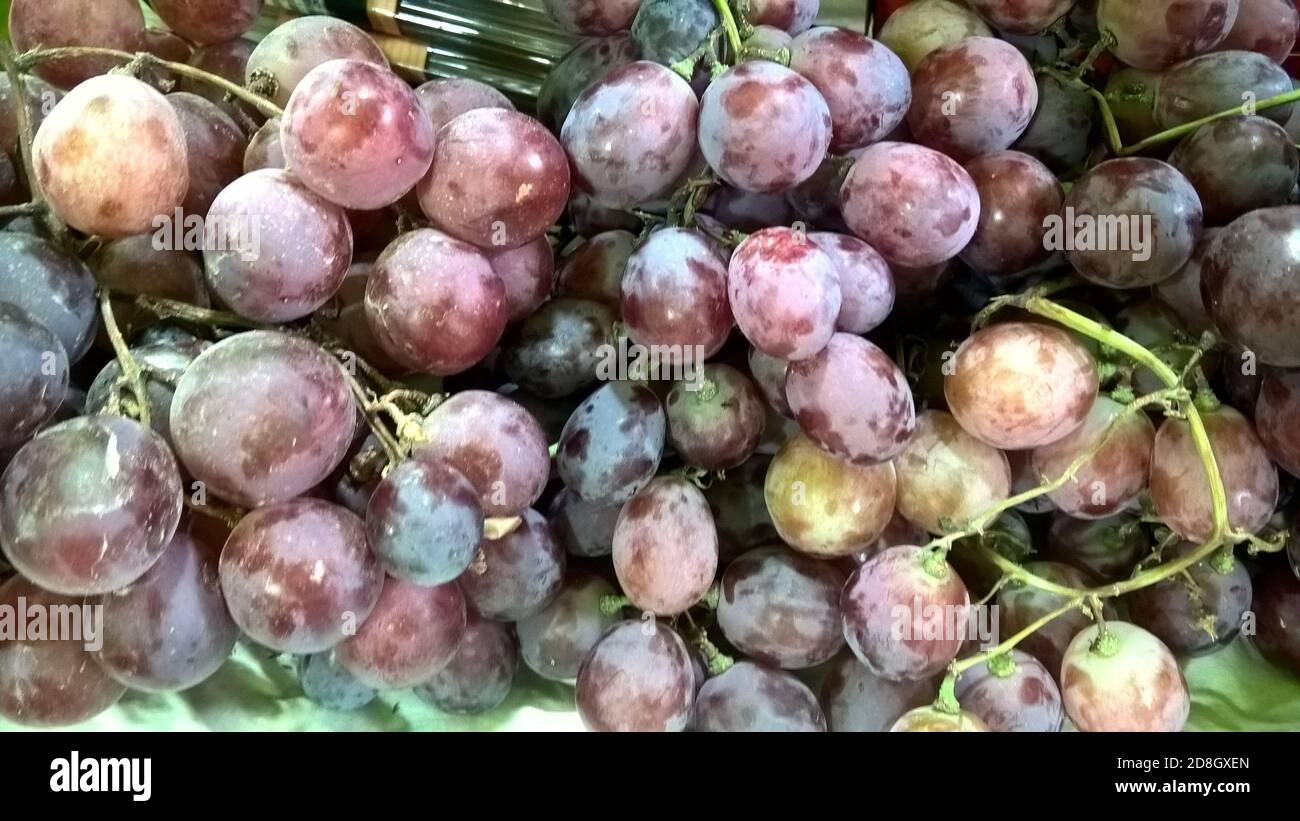 Closeup view of Red color Grapes fruit Stock Photo - Alamy
