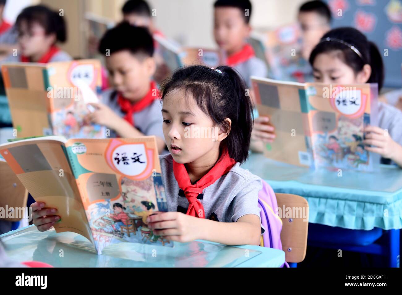 Students take their first class in the new semester at a local primary ...