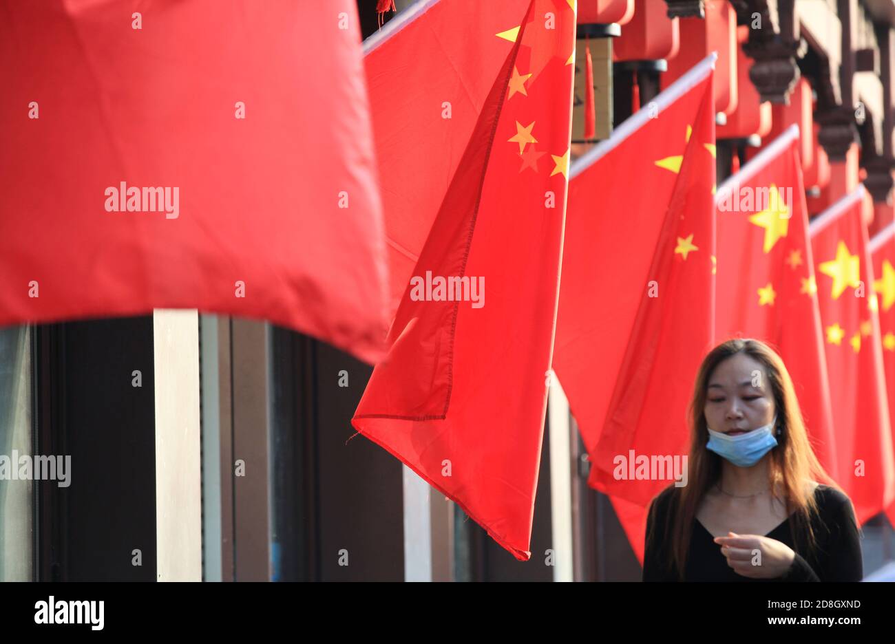 A line of Chinese national flags fly on the street prior to the ...