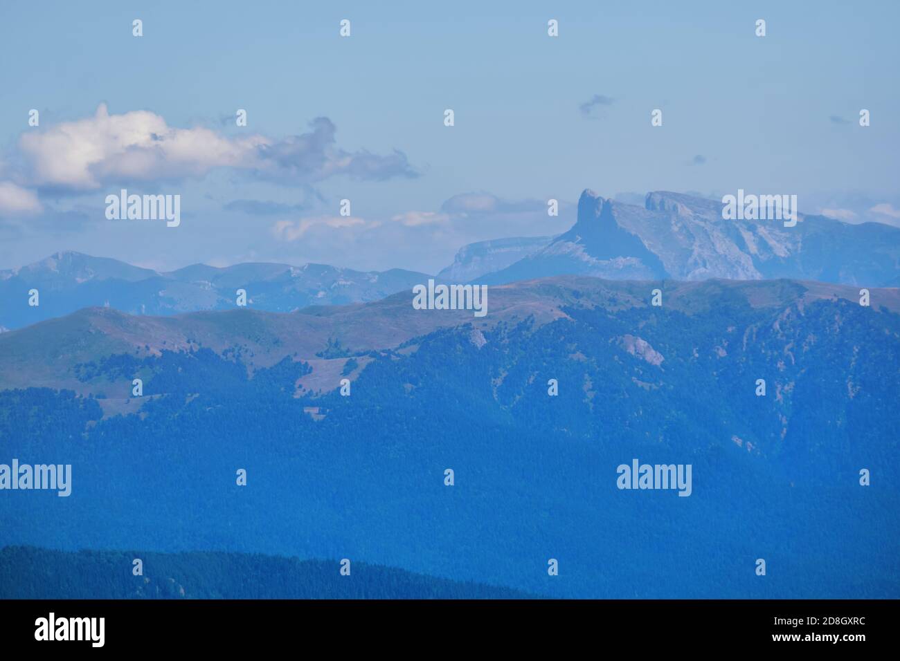 view from the mount peak to the distant mountain ranges on the horizon ...