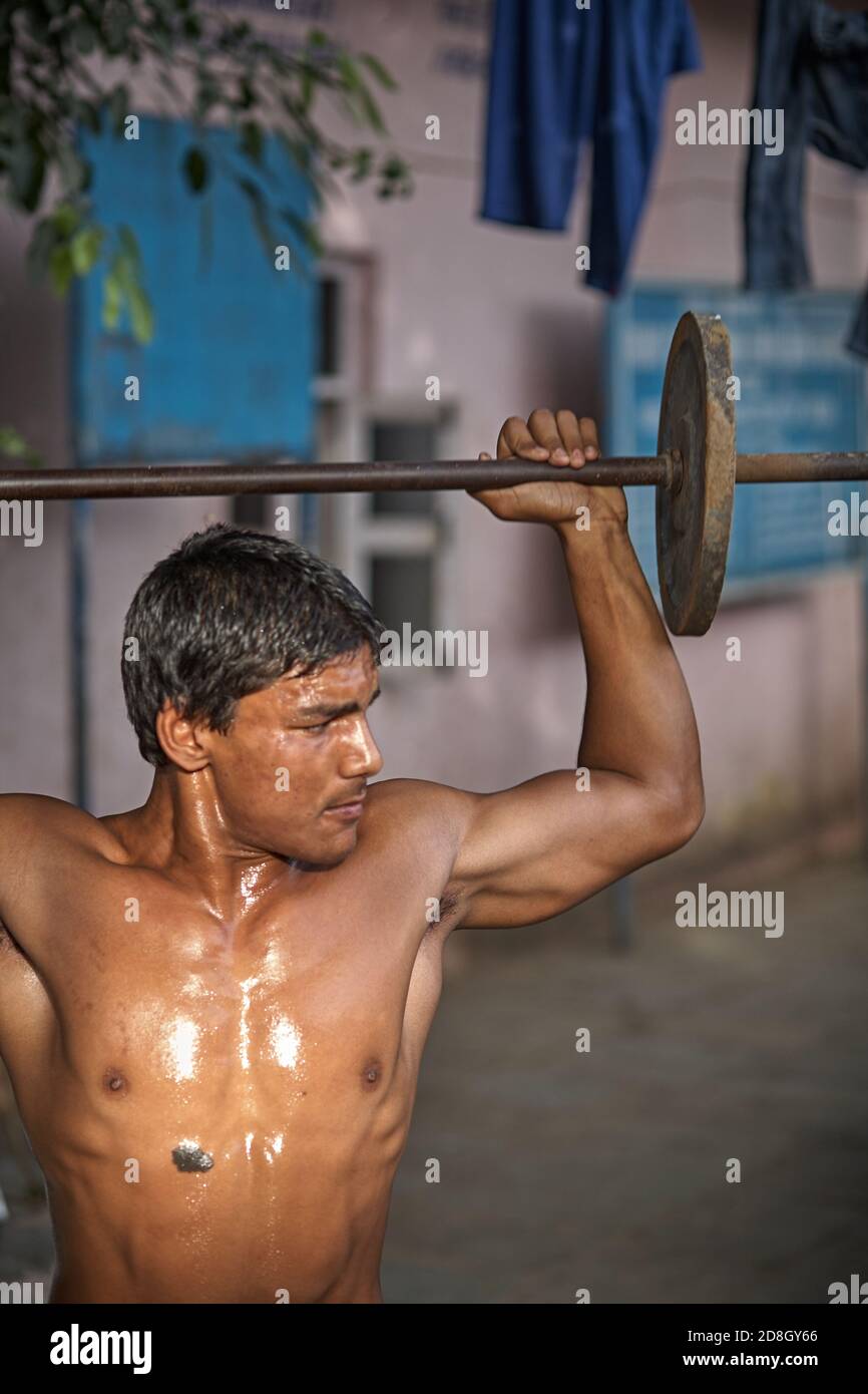 Delhi, India, May 2012. Kushti wrestler in the akhara in his daily ...