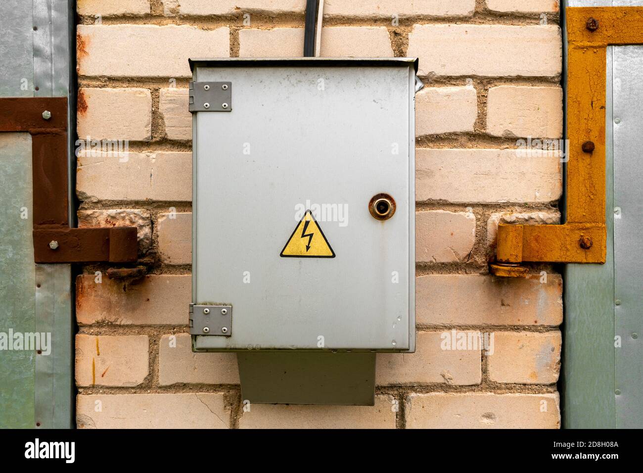 Electrical switch panel on the brick wall exterior Stock Photo - Alamy