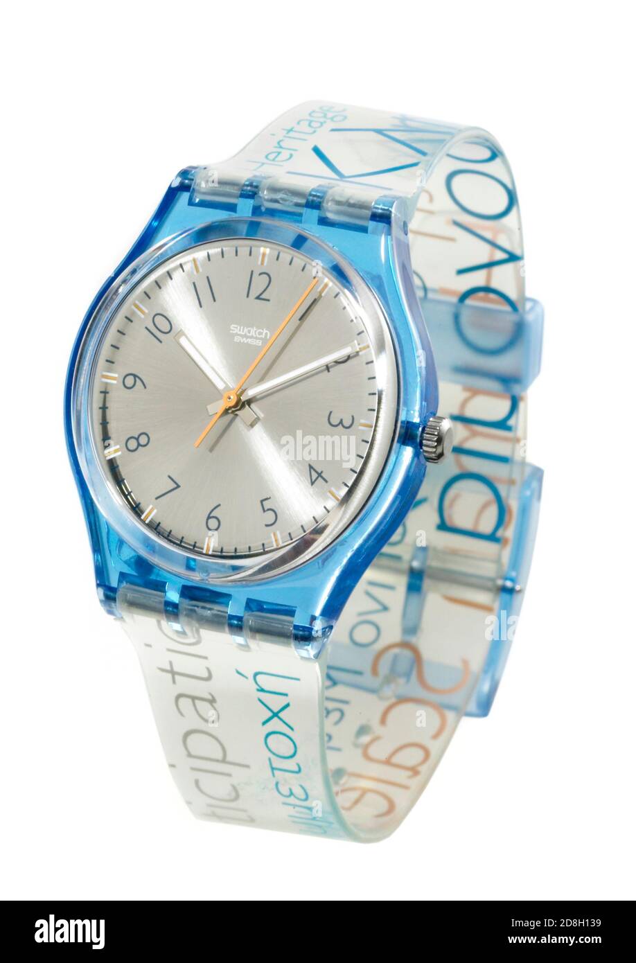 Clear and blue analog Swatch watch photographed on a white background ...
