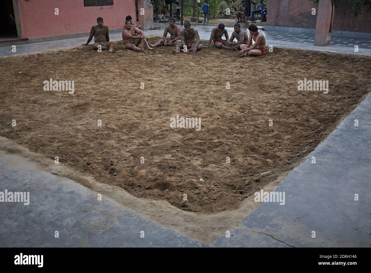 Delhi, India, May 2012. Kushti wrestlers resting in the akhara in his ...
