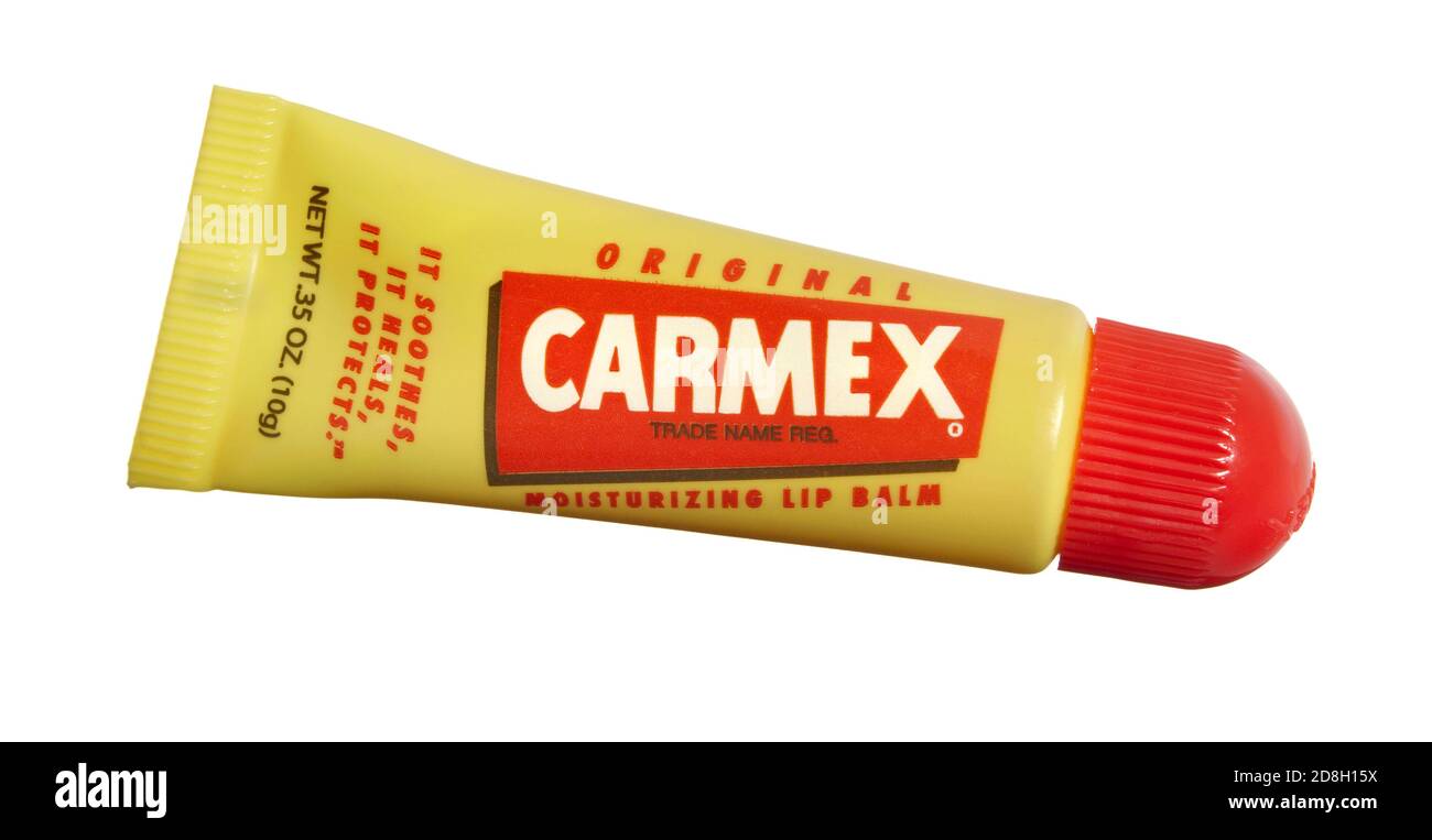 Small tube of original carmex lip balm photographed on a white ...
