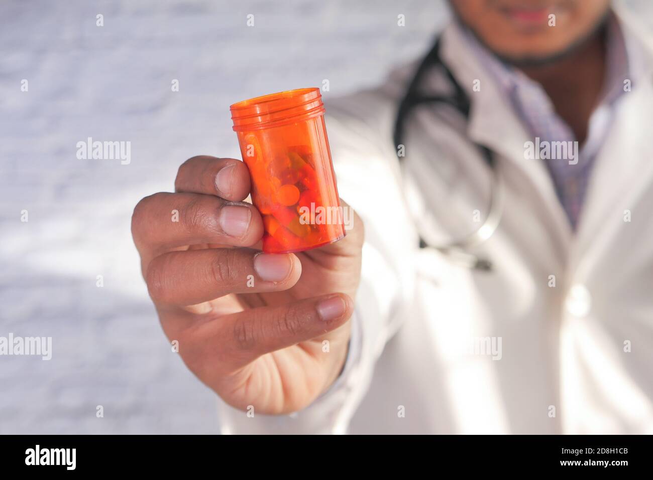 Doctor hand holding pill container hi-res stock photography and images ...
