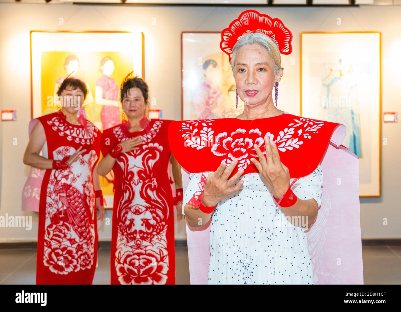 Elder models present papercut qipao or Chinese long gown at Shenyang ...