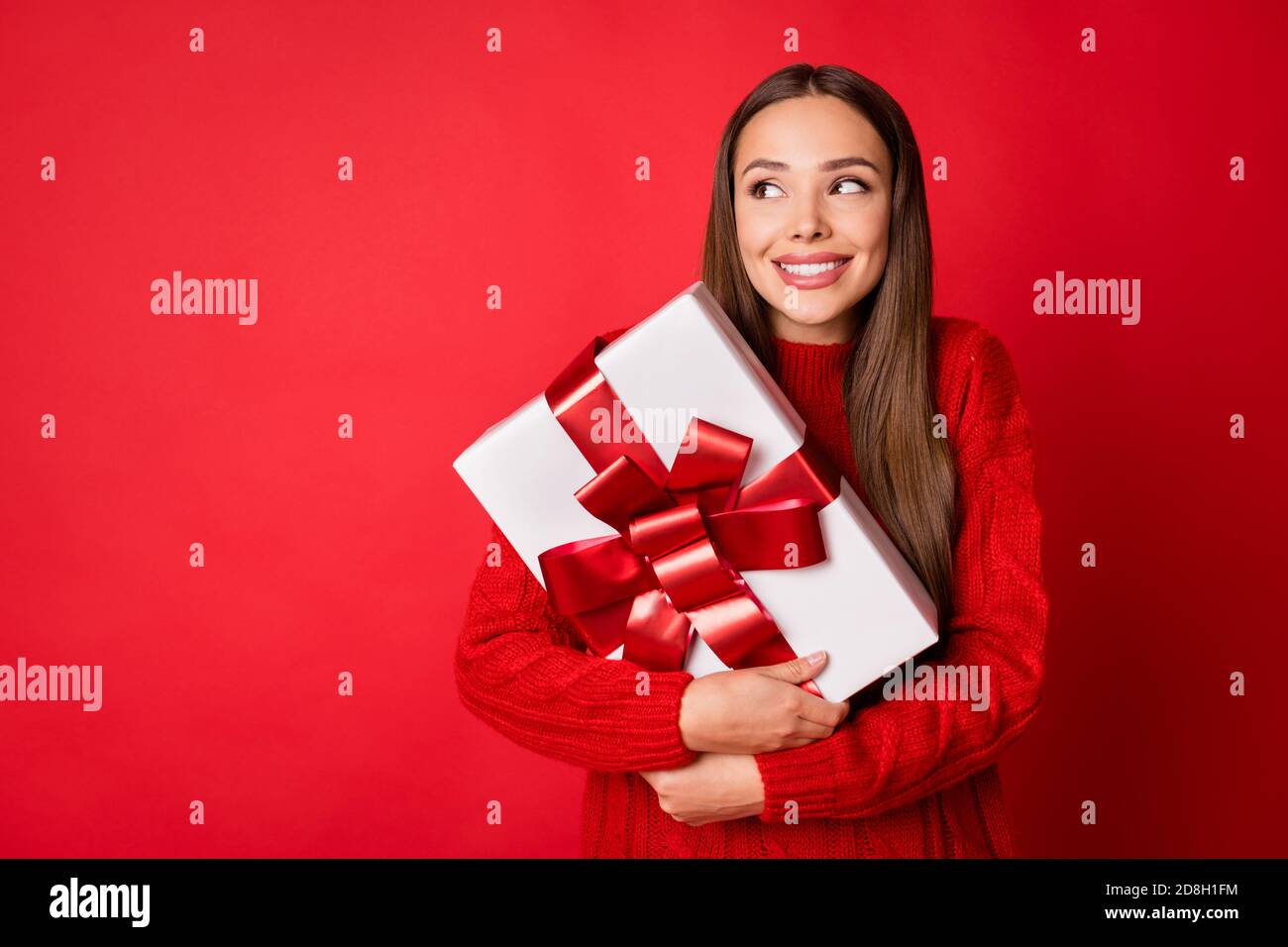 Photo of girl hug gift box look copyspace wear jumper isolated over ...