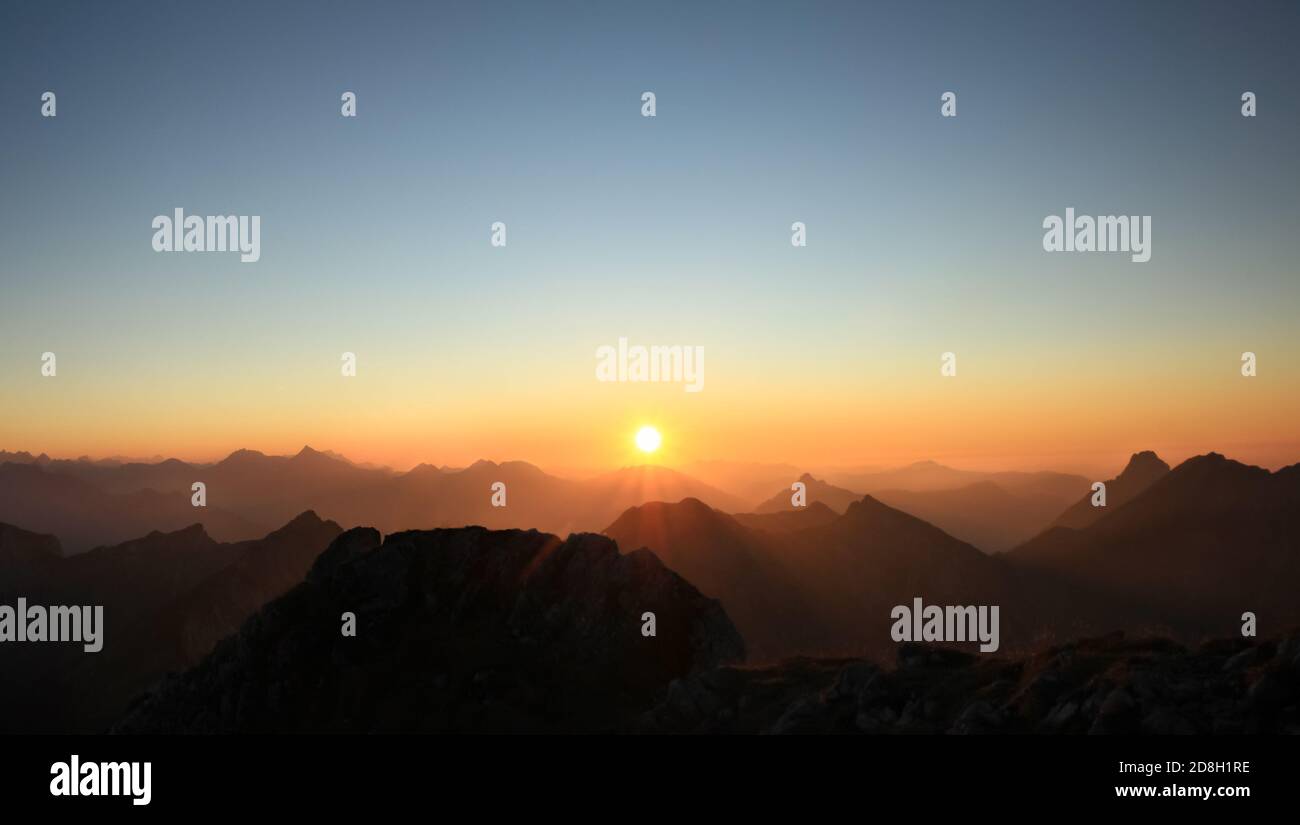 Beautiful Sunset or Sunrise above Mountains with clear sky. Alps ...
